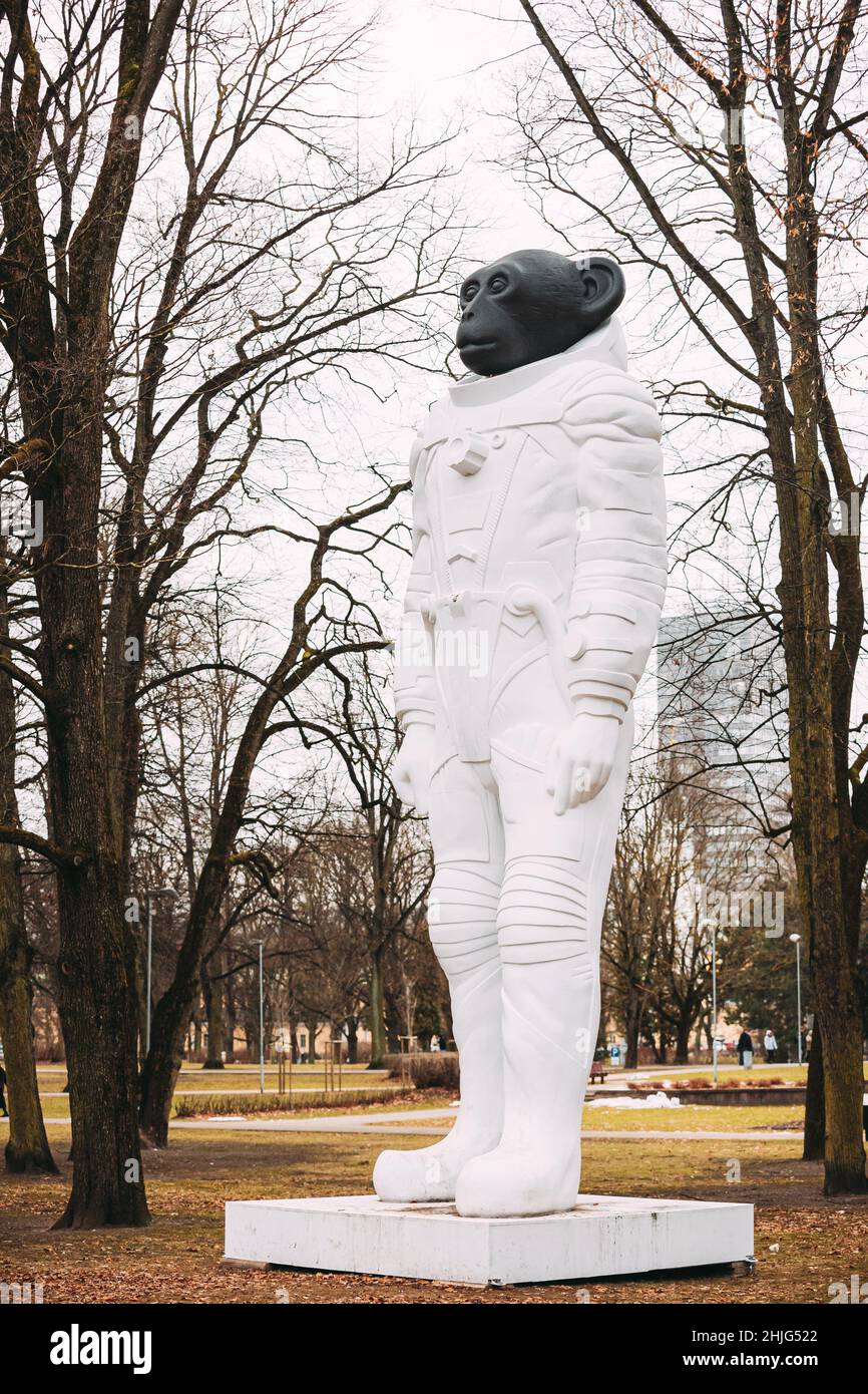 Riga, Latvia. Monkey statue in a spacesuit in Kronvalda park. Statue is ...