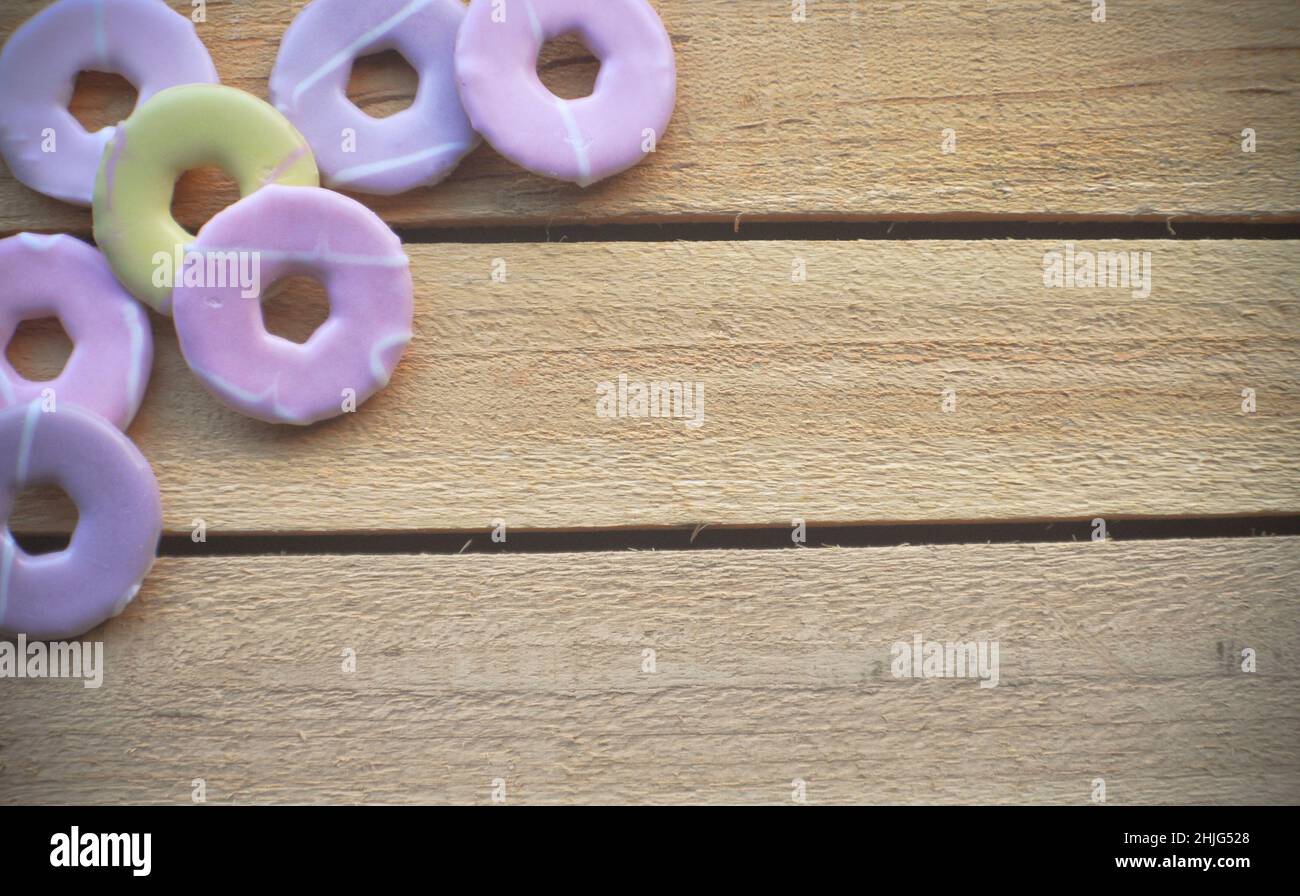 Party ring biscuits by FOX's set against a wooden background with copy ...
