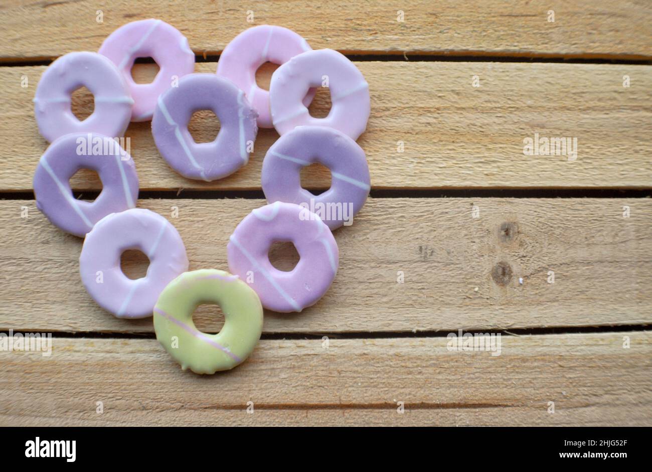 Party ring biscuits by FOX's set against a wooden background with copy ...