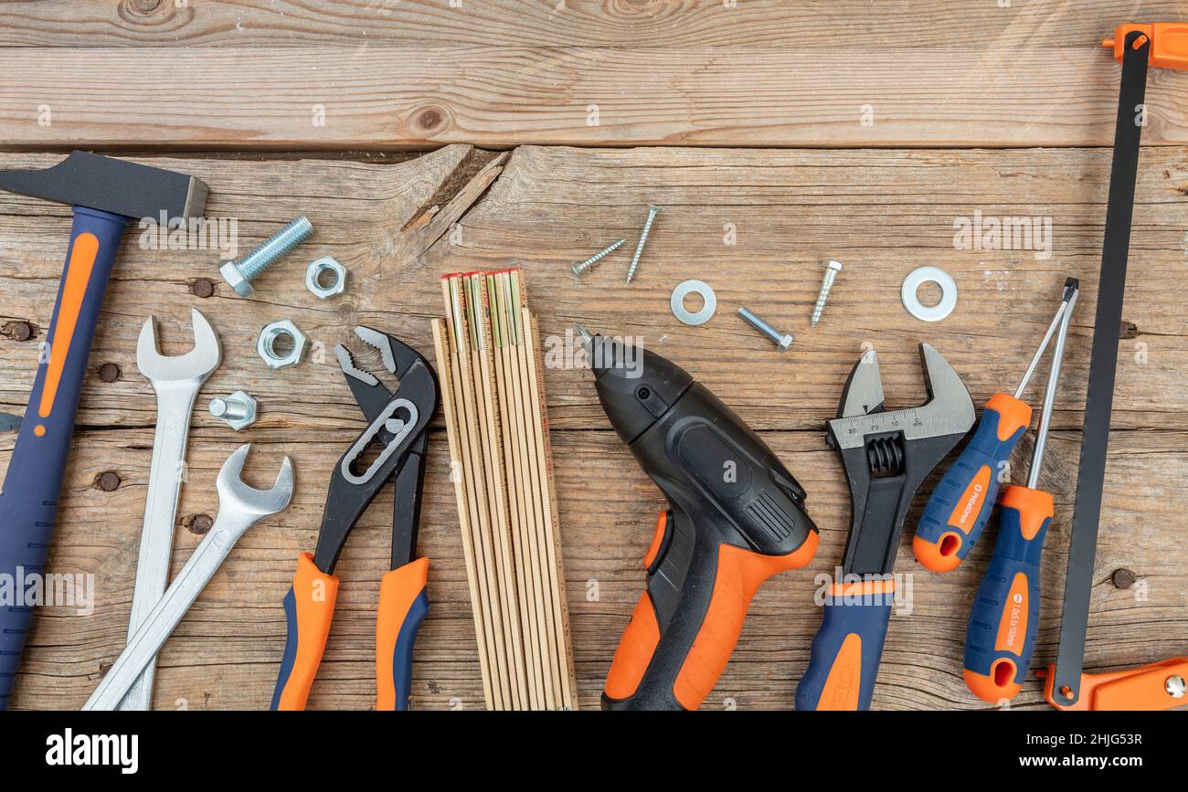 Work tool repair service hardware on wood, overhead, top view. DIY ...