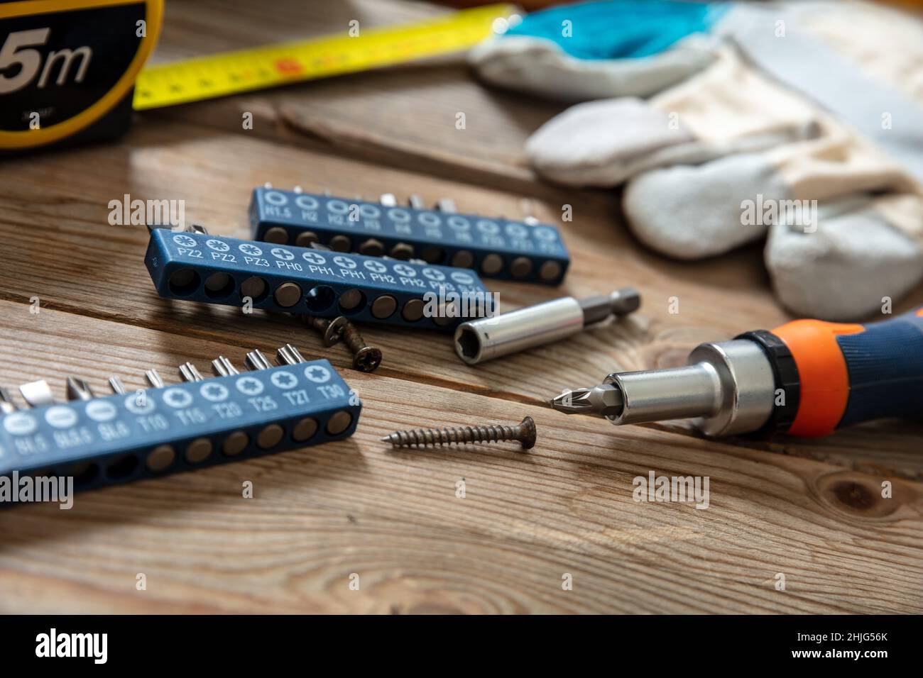 Screw drive. Adjustable torque screwdriver, work tool on wooden ...