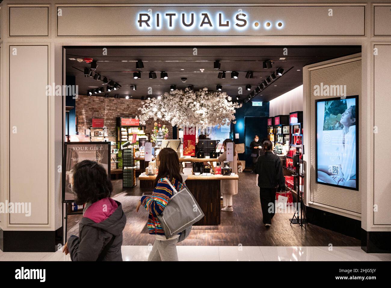 Shoppers walk past the Dutch cosmetics brand Rituals store in Hong Kong ...