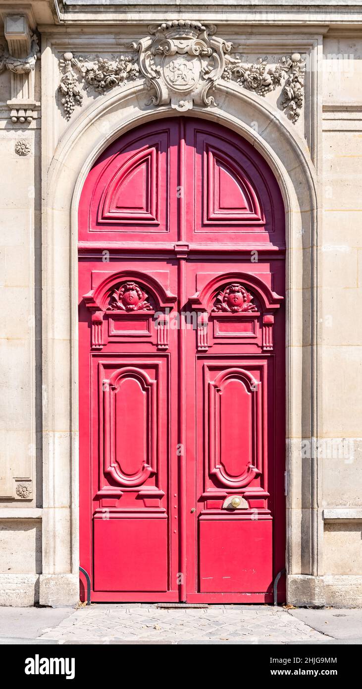 Paris, a red wooden door, typical building in the 7th arrondissement, a ...