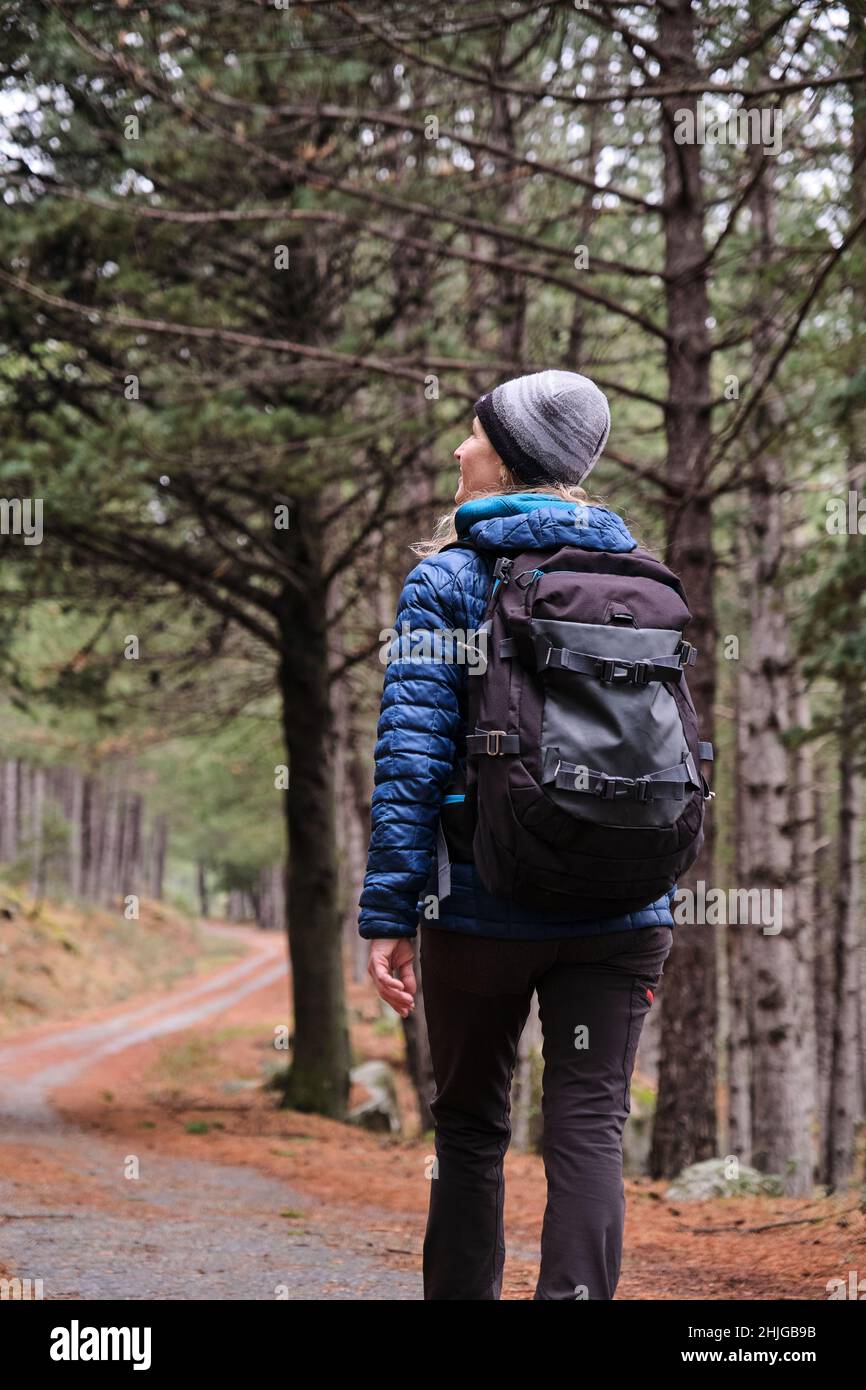 Hiker walking along a path in the forest Stock Photo - Alamy