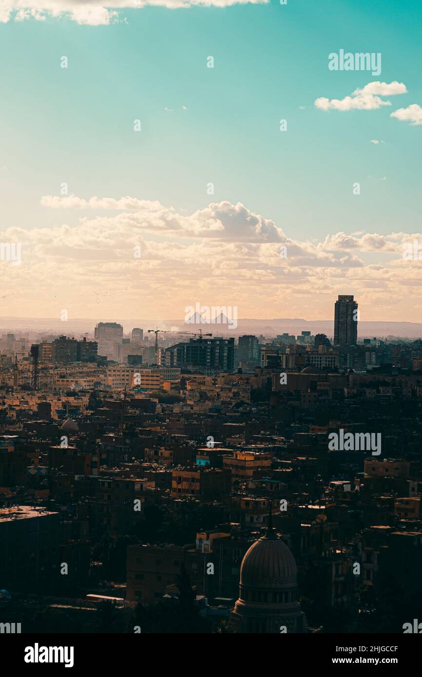 Vrtical shot of the great Giza pyramids in the distance, seen from ...