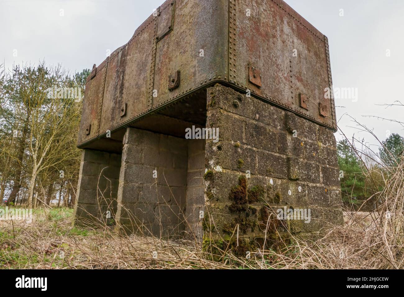 detailed close up of a rusting red brown iron water tank raised on ...