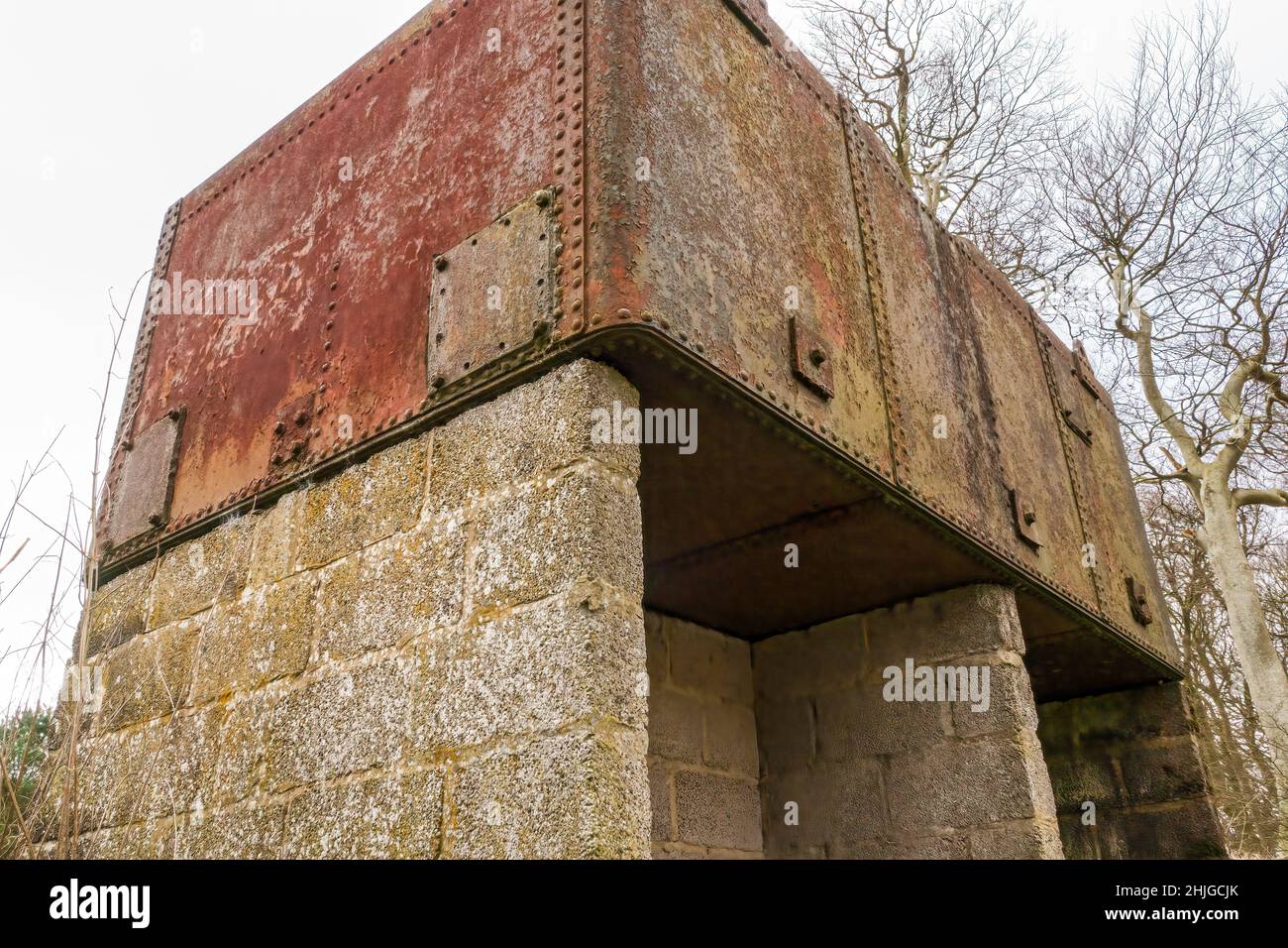 detailed close up of a rusting red brown iron water tank raised on ...