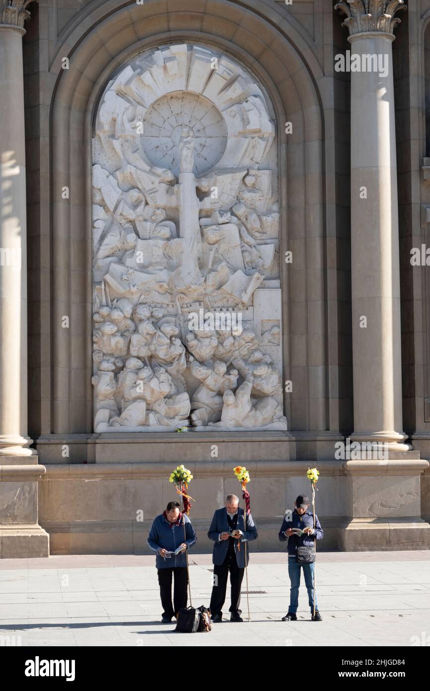 Three men praying in front of the basilica hi-res stock photography and ...