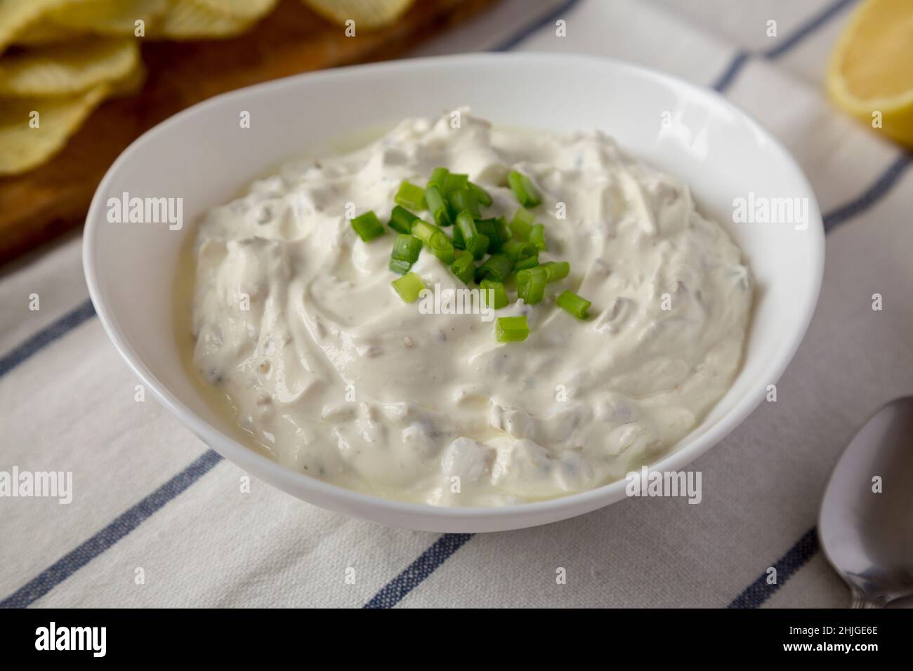 Homemade Clam Dip with Potato Chips, side view. Close-up Stock Photo ...