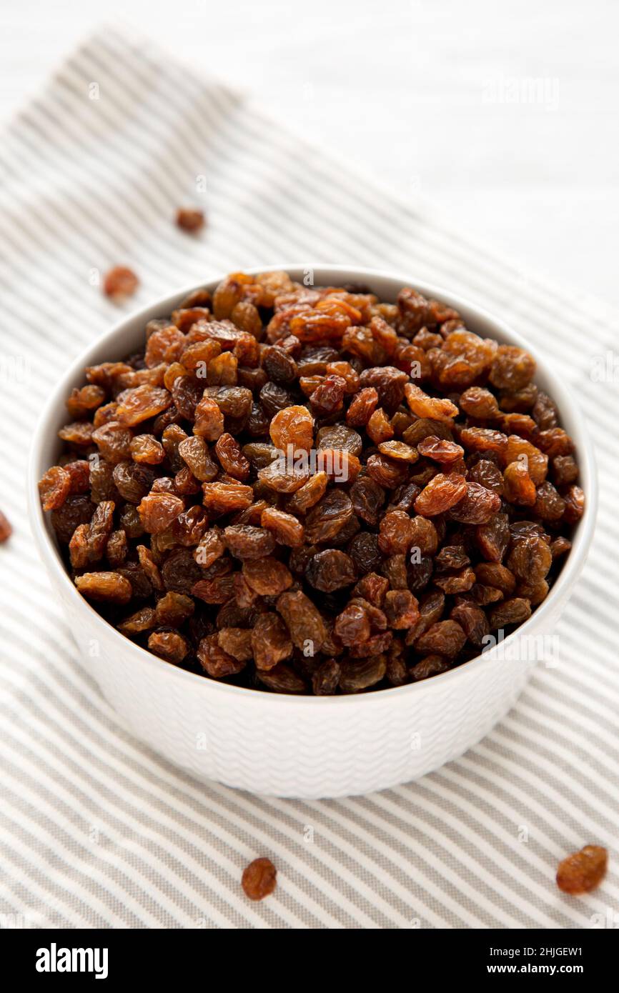 Dried Brown Raisins in a Gray Bowl, side view Stock Photo - Alamy