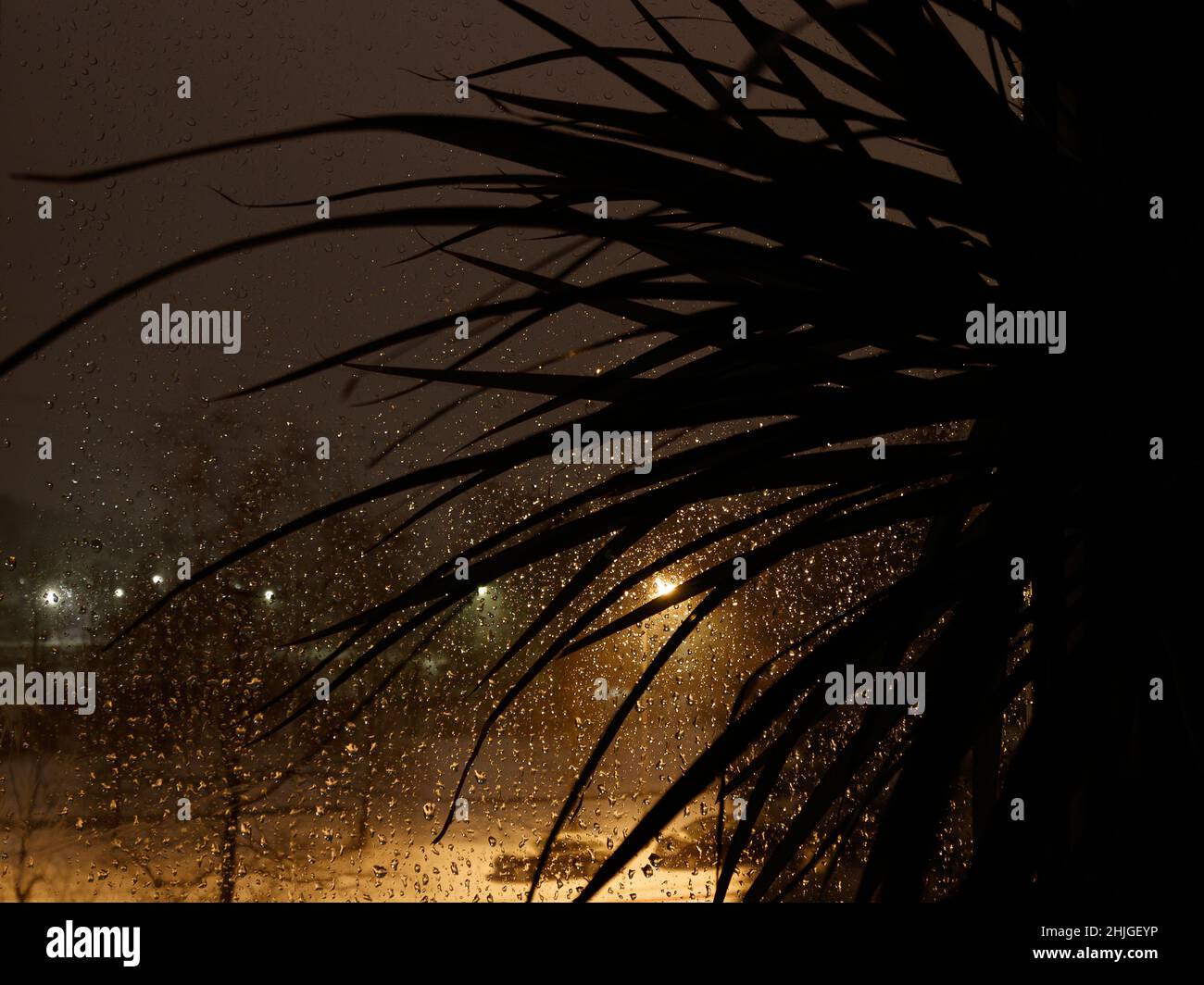 Dark night, view through the window, just after the storm. Raindrops ...