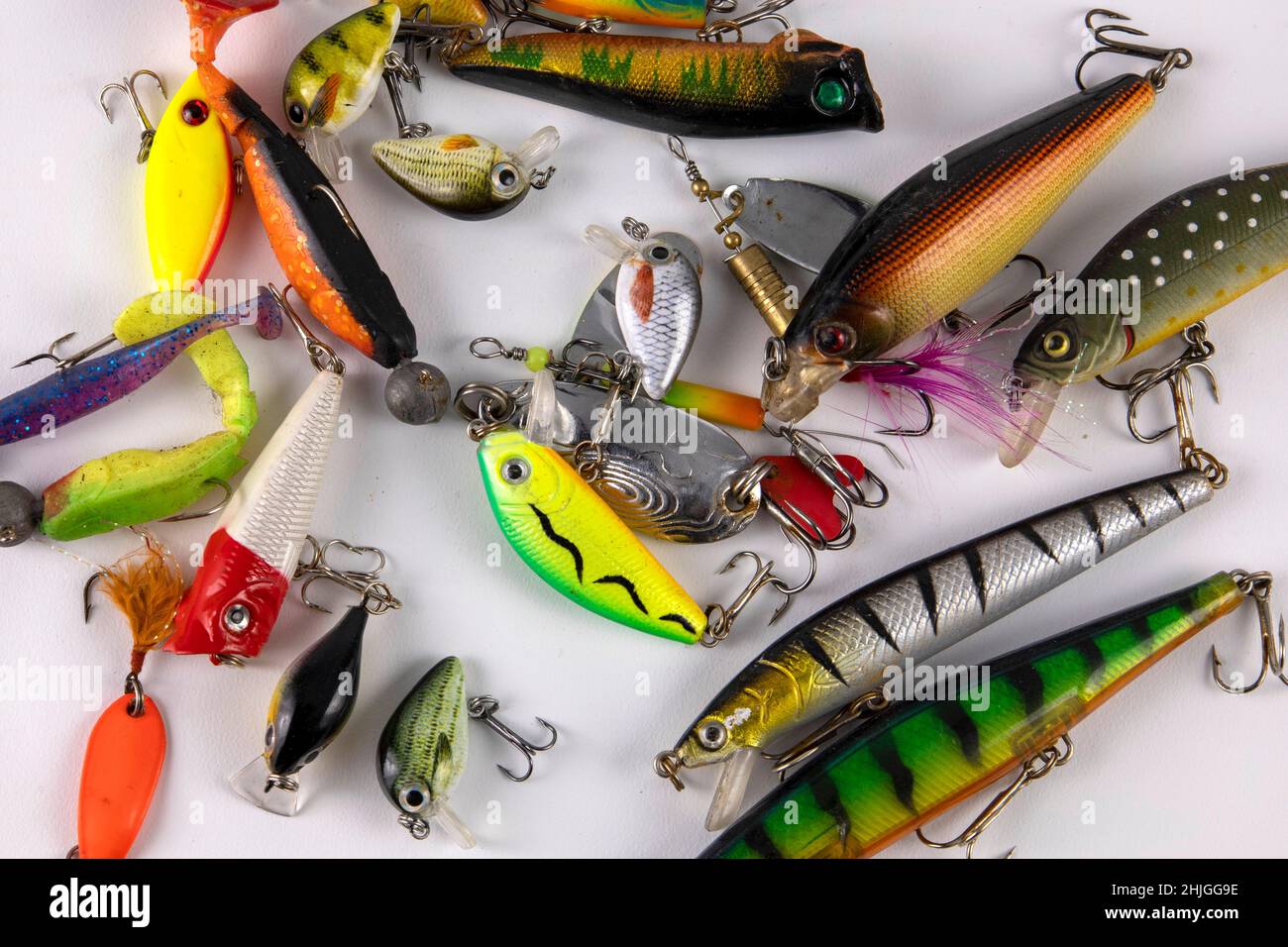 Lots of fishing lures for predatory fish on white Stock Photo - Alamy