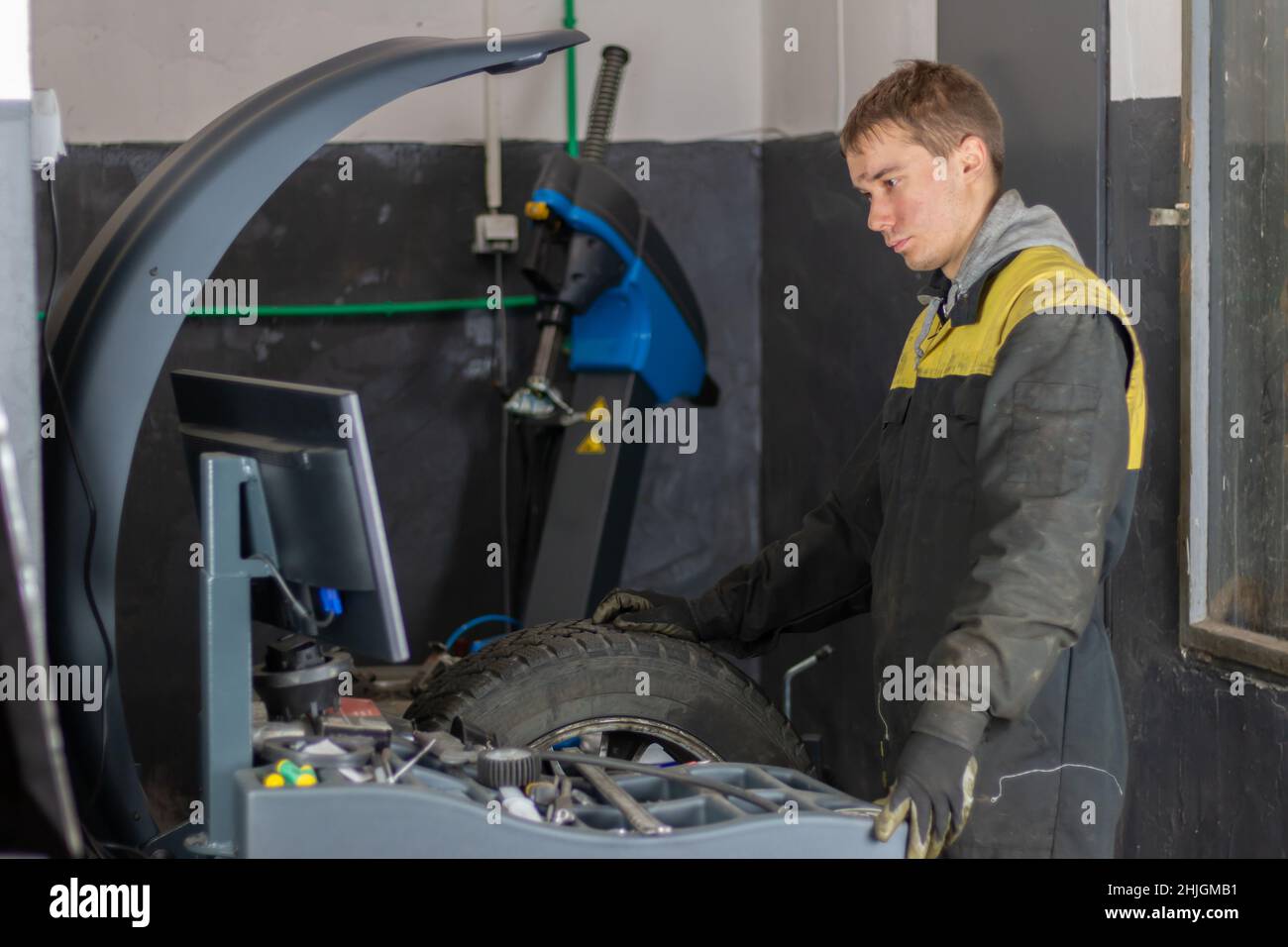 Car master mechanic vulcanizer repairing tire on auto vulcanizing ...