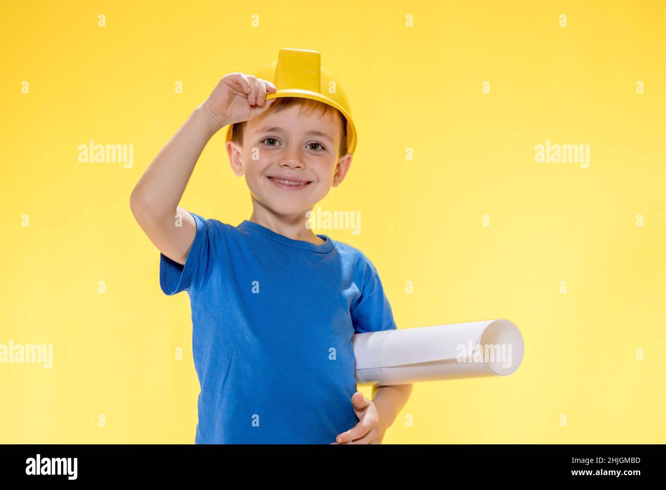 A little boy holding plan project in his hands dreams of becoming a ...