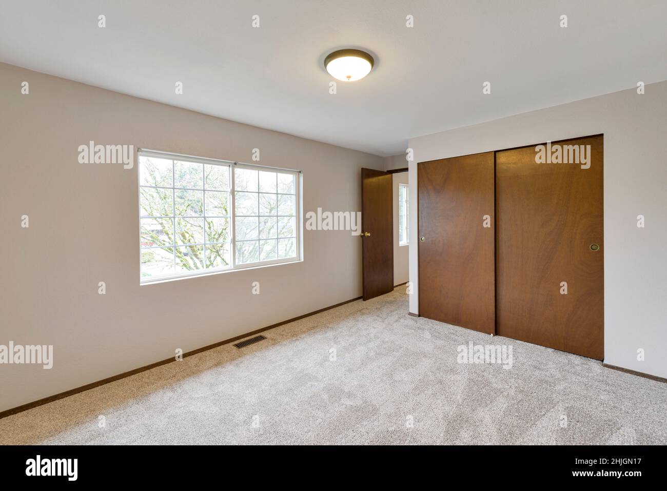 Modern residential empty bedroom interior Stock Photo - Alamy