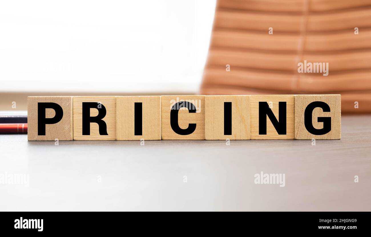 Pricing Word Written In Wooden Cube Stock Photo - Alamy