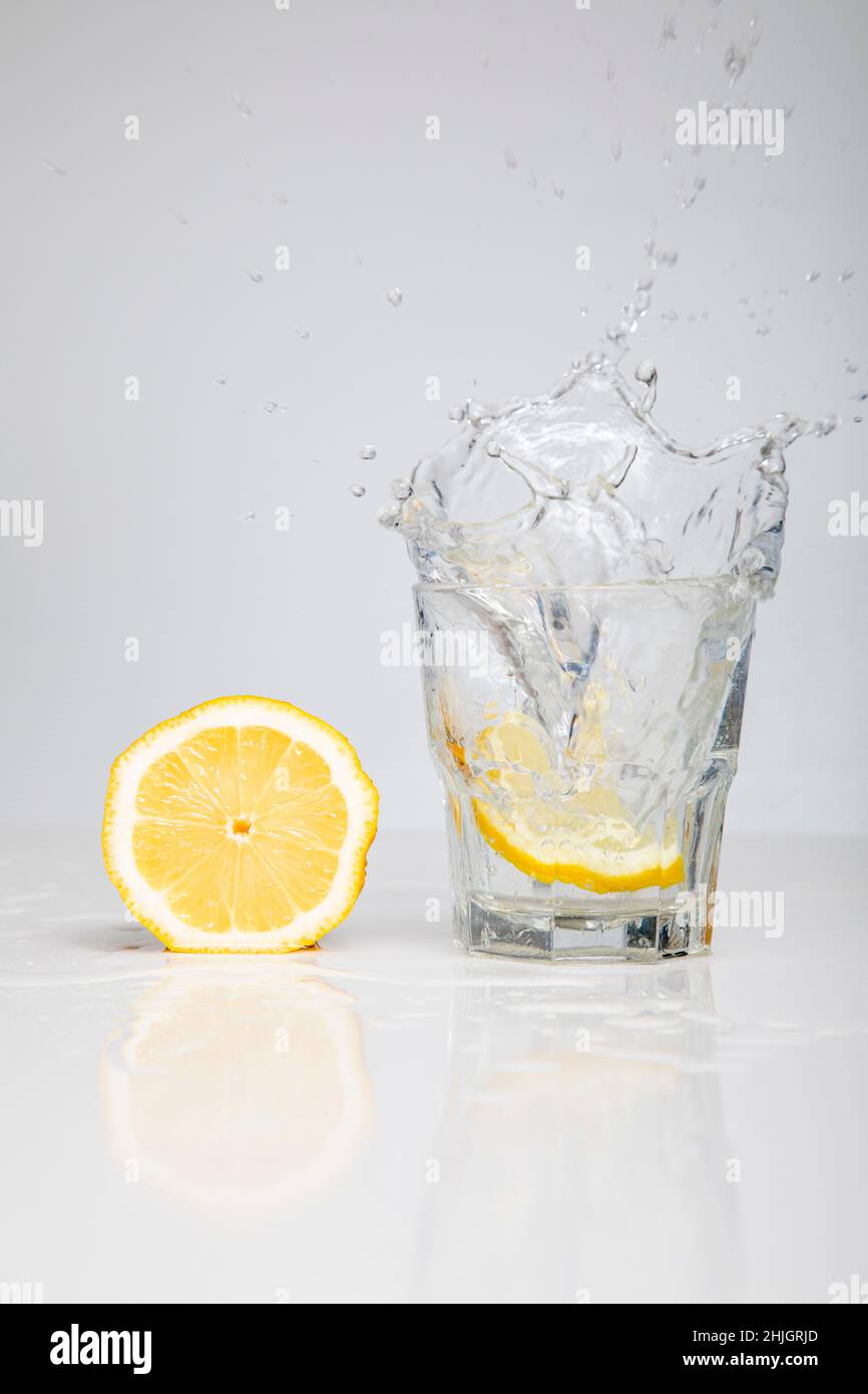 Chilled water and lemon in a glass Stock Photo - Alamy