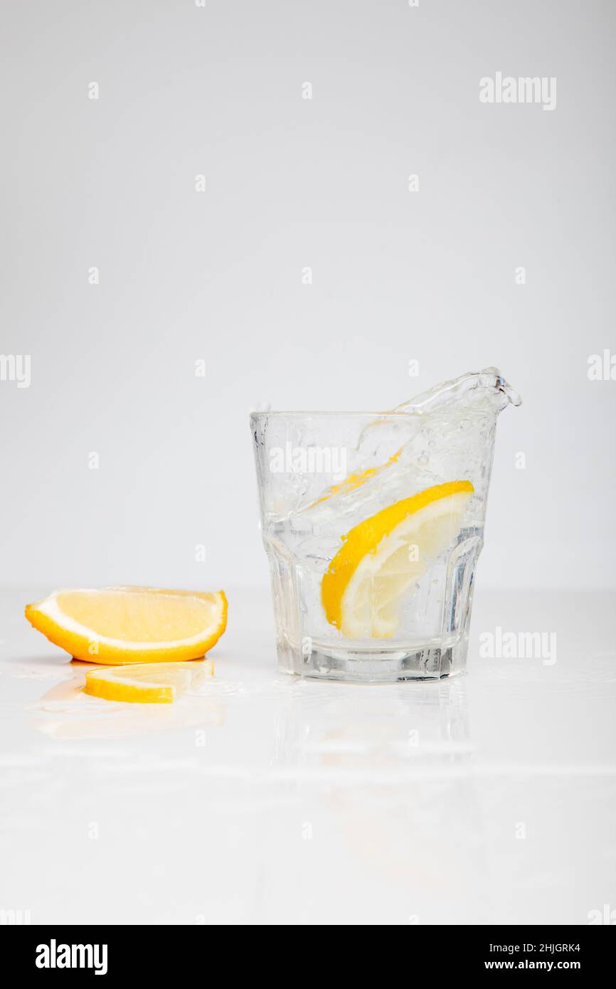 Chilled water and lemon in a glass Stock Photo - Alamy