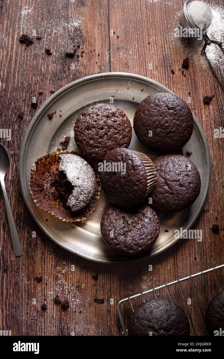 Homemade chocolate muffins on a silver plate Stock Photo - Alamy