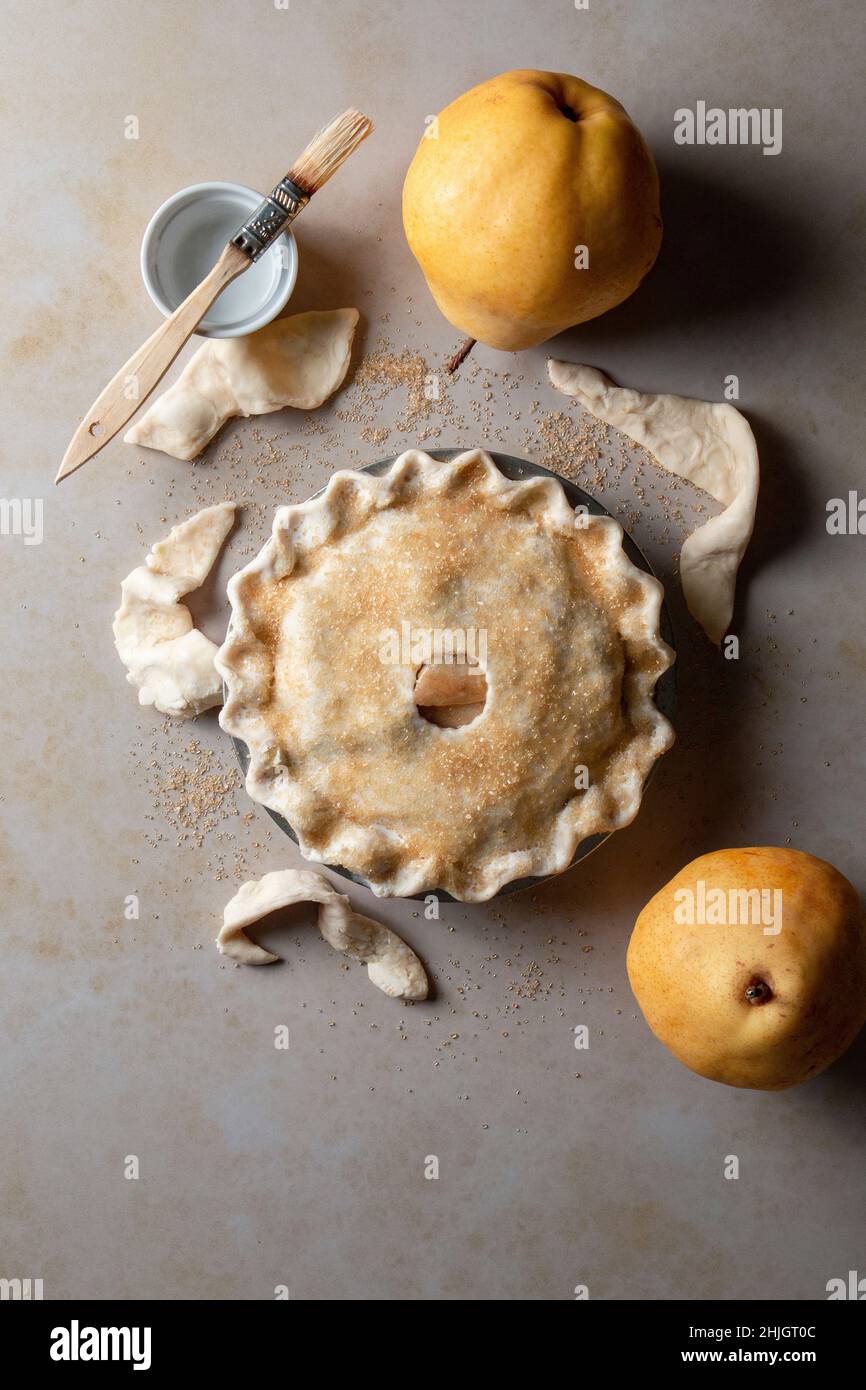 Pear pie process shot on neutral background, with homemade pastry Stock ...