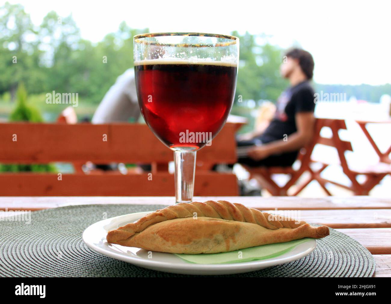 Traditional Lithuanian pastries Kibinai and glass of beer. Food popular ...