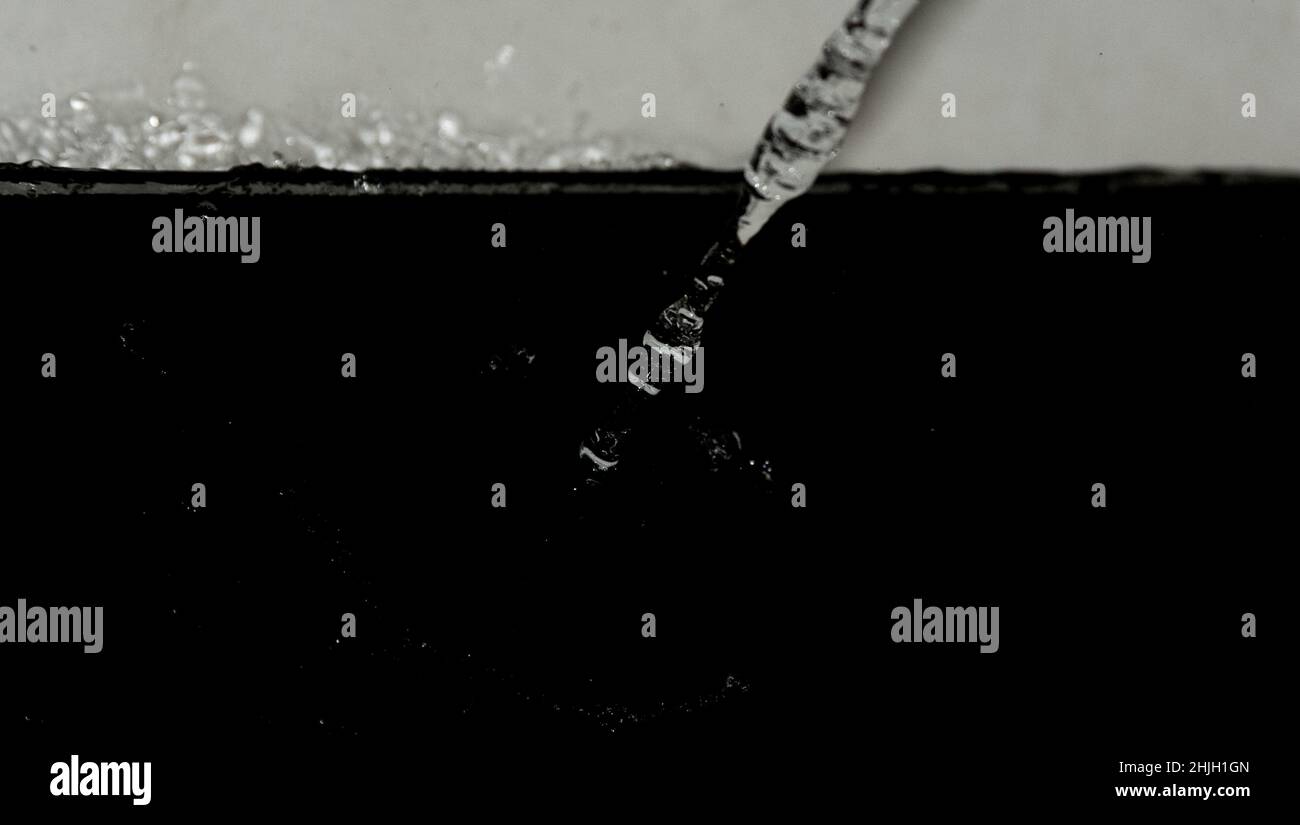 Grayscale of flowing water splash Stock Photo - Alamy