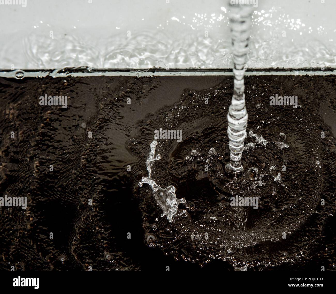 Grayscale of flowing water splash Stock Photo - Alamy