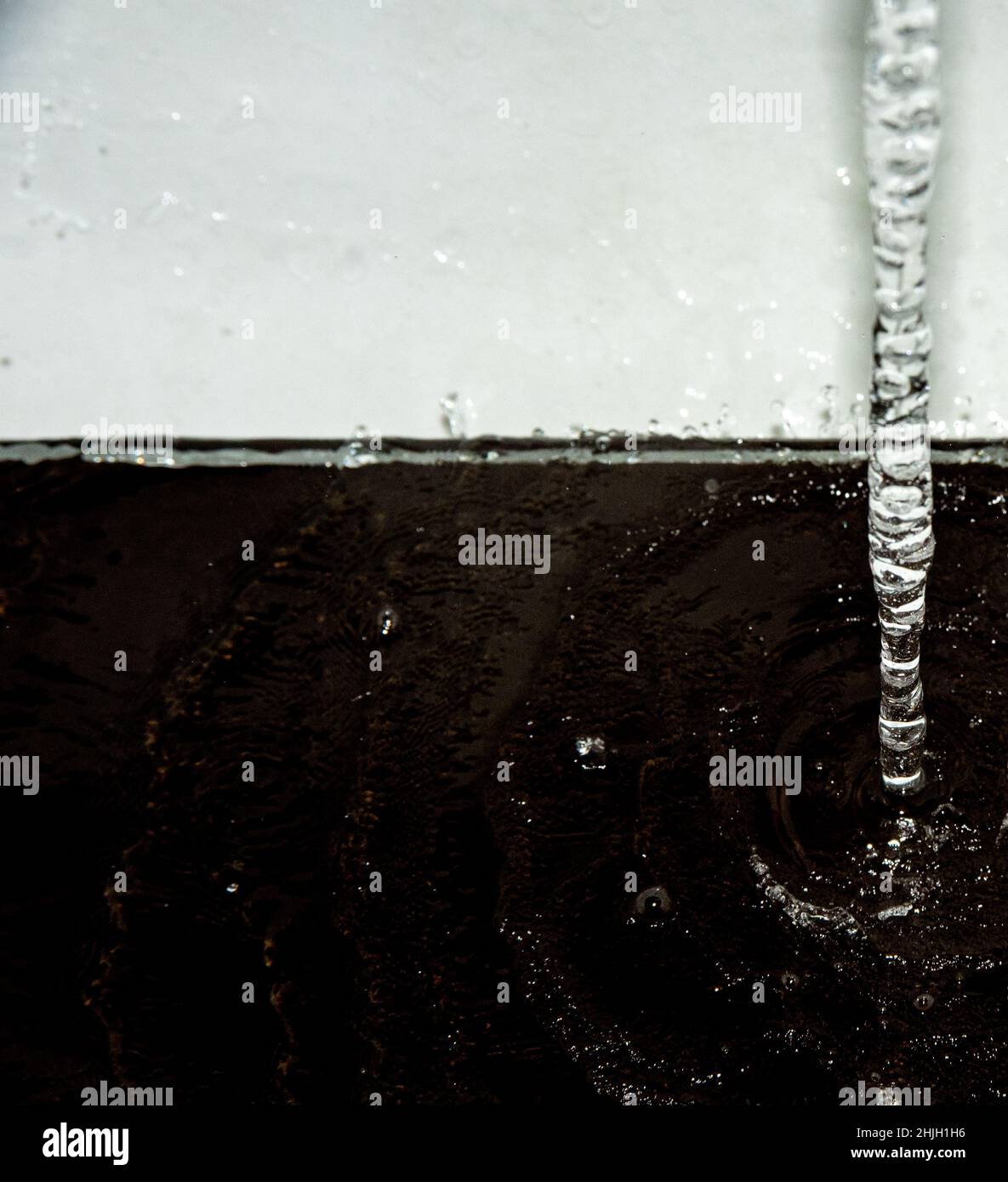 Grayscale of flowing water splash Stock Photo - Alamy