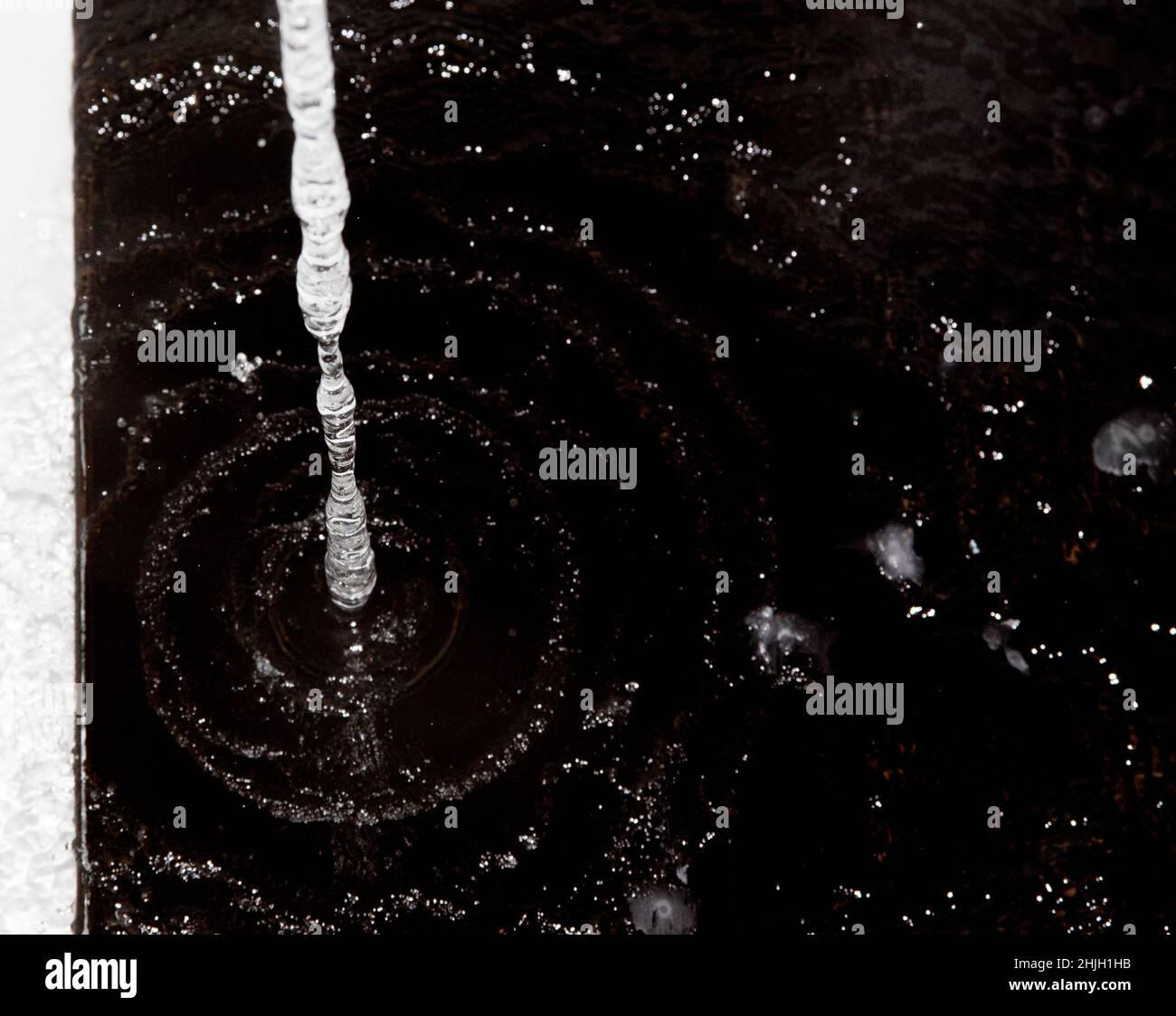 Grayscale of flowing water splash Stock Photo - Alamy
