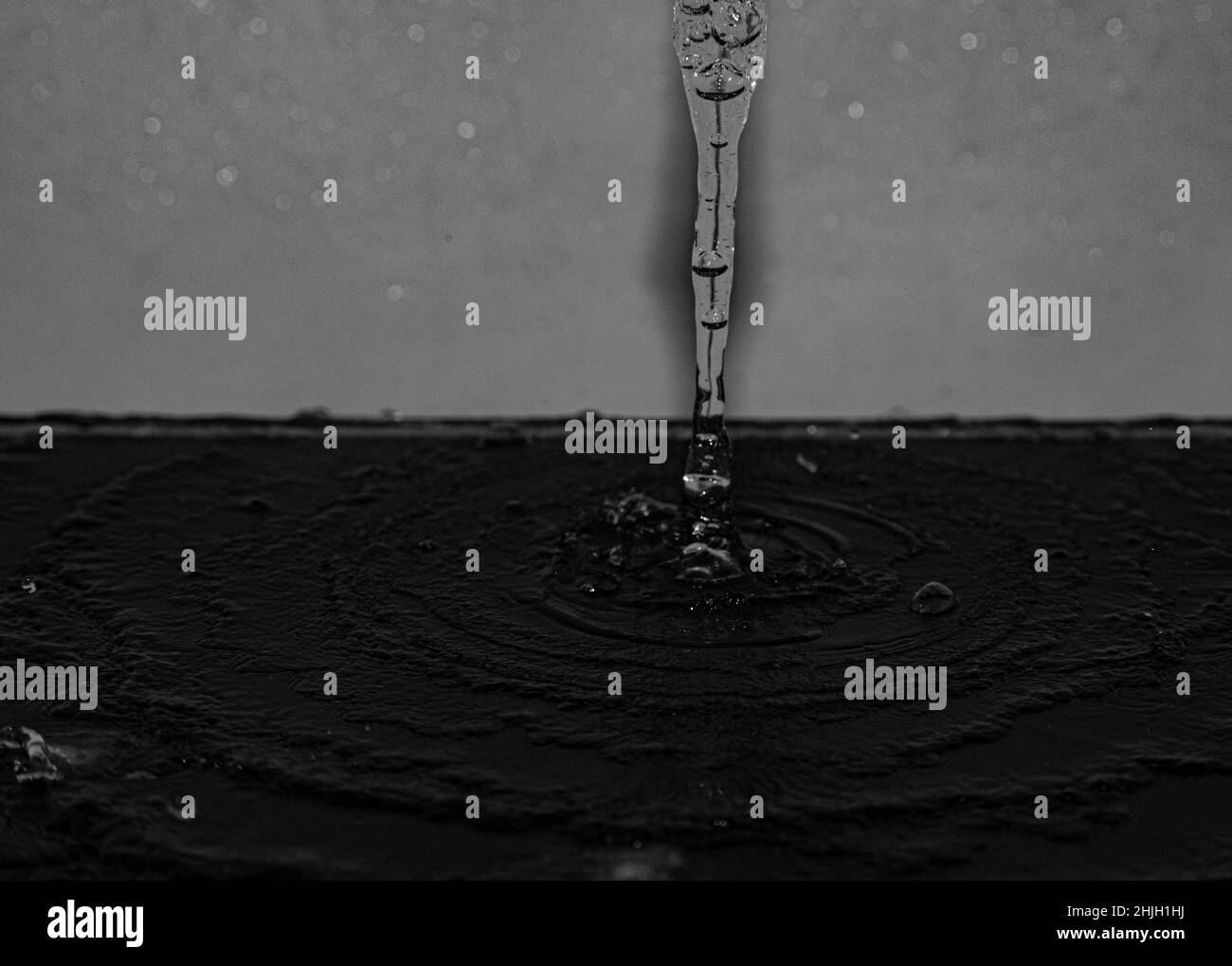 Grayscale of flowing water splash Stock Photo - Alamy
