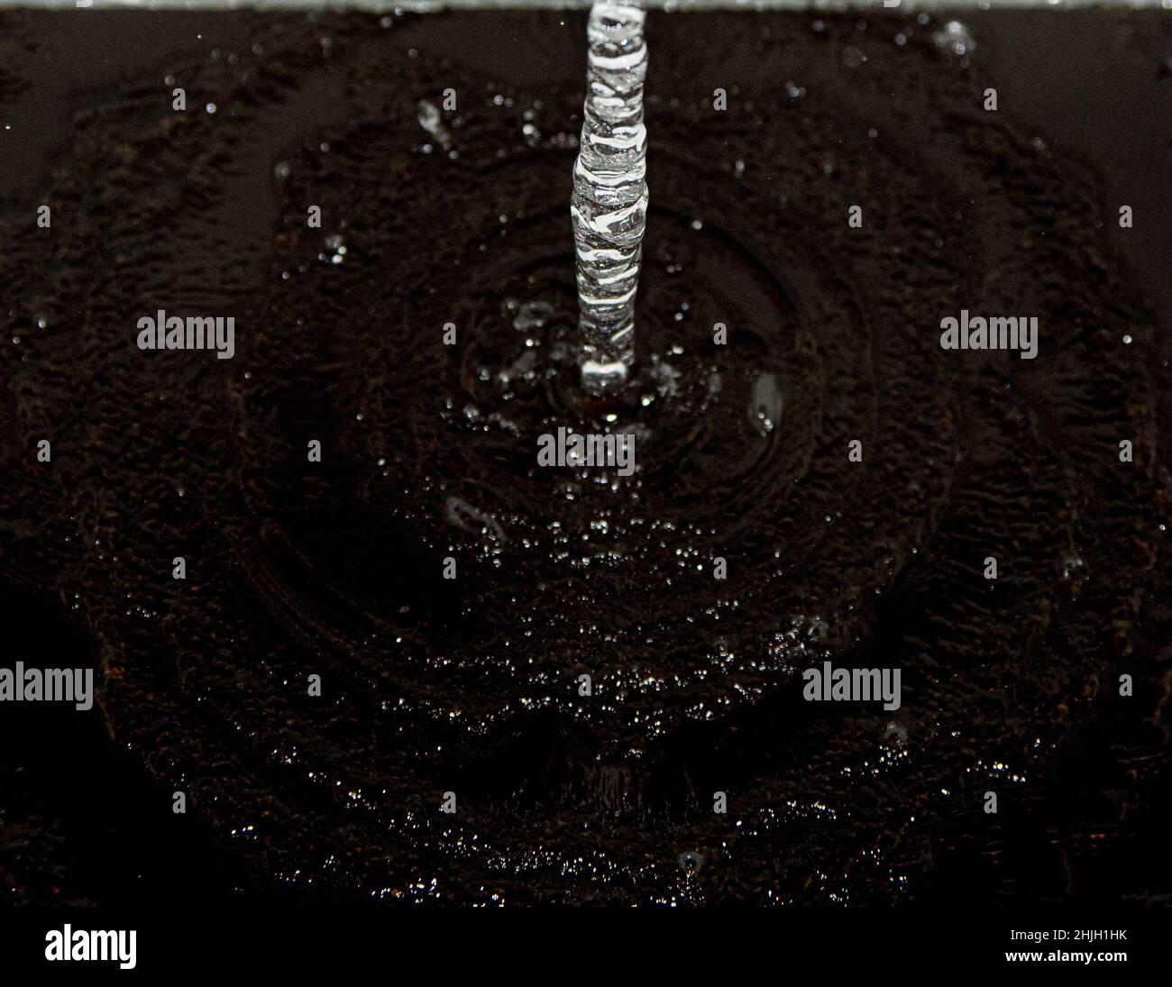 Grayscale of flowing water splash Stock Photo - Alamy