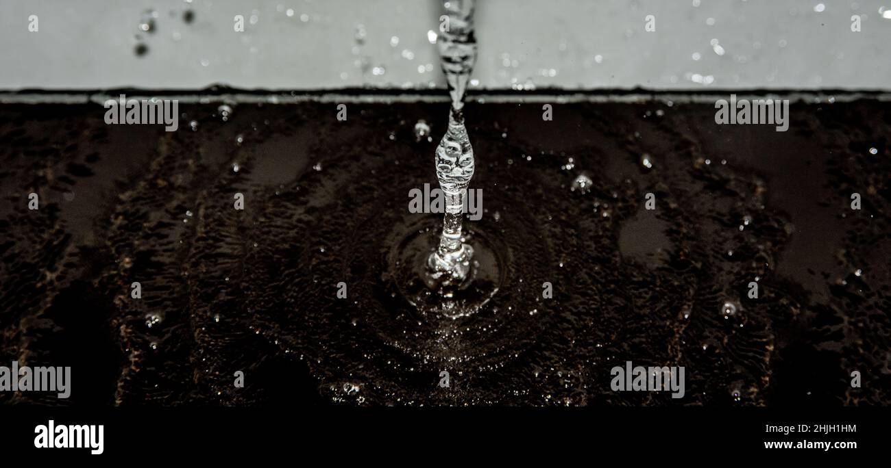 A grayscale of flowing water splash Stock Photo - Alamy