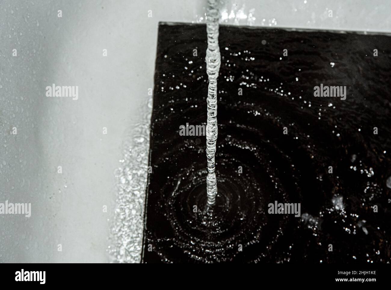 Grayscale of flowing water splash Stock Photo - Alamy