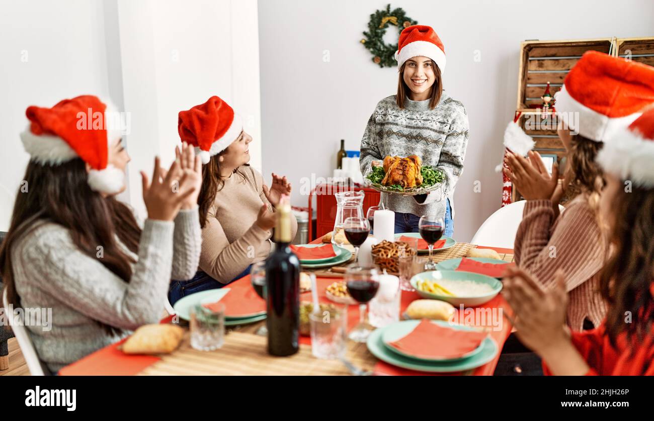 Group of hispanic women clapping and sitting on the table. Woman ...