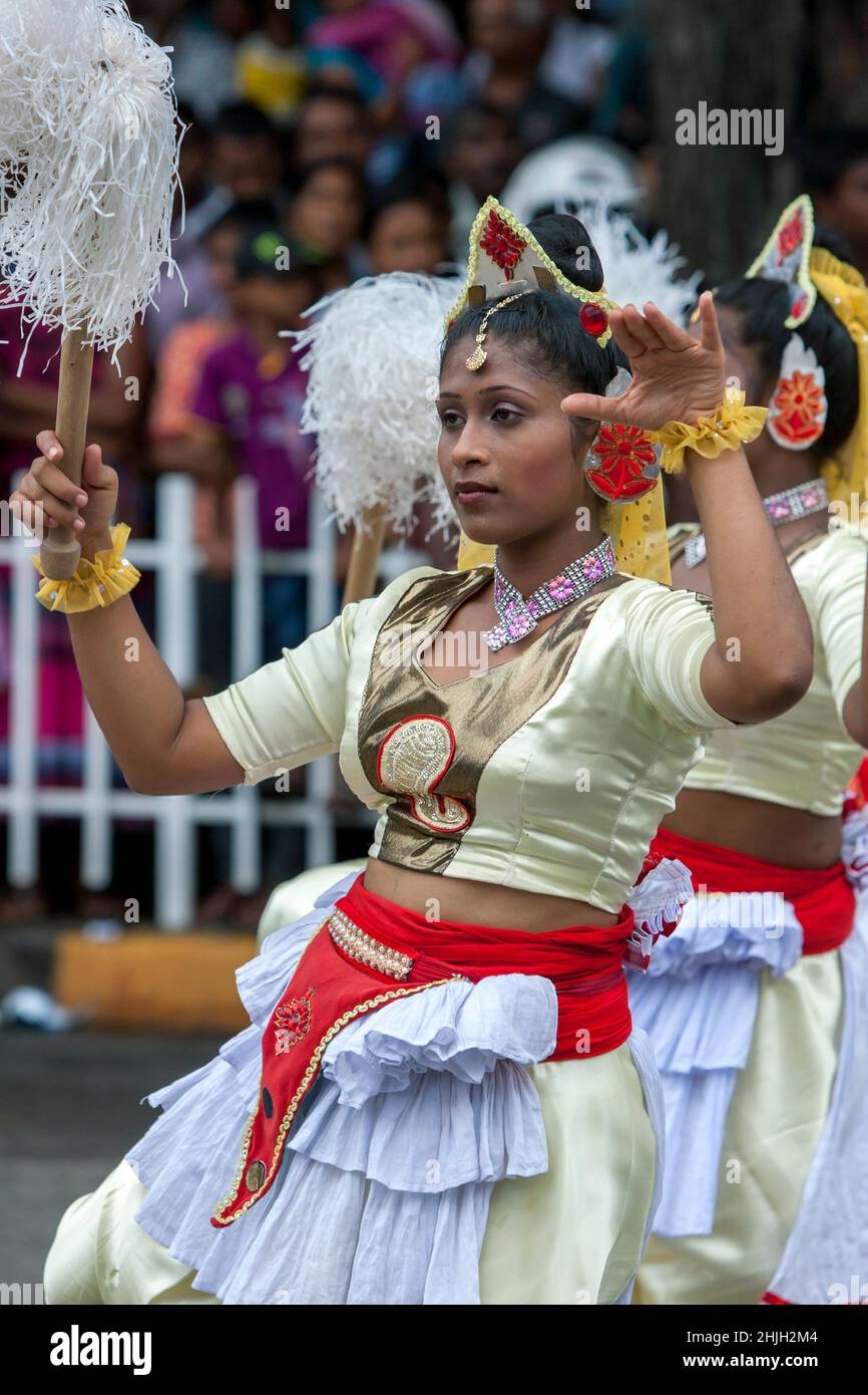 A lady performs along Sri Dalada Veediya during the Buddhist Day ...