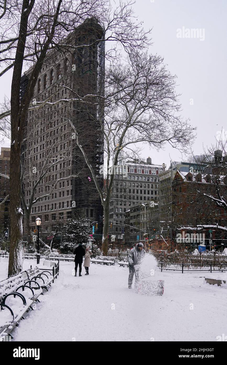 Madison Square Park after a winter storm: park employee removing snow ...