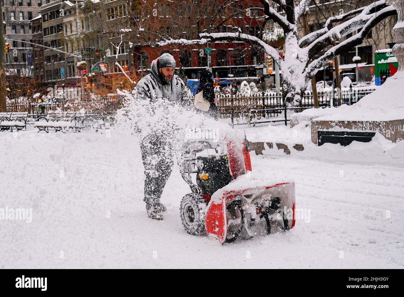 Madison Square Park after a winter storm: park employee removing snow ...