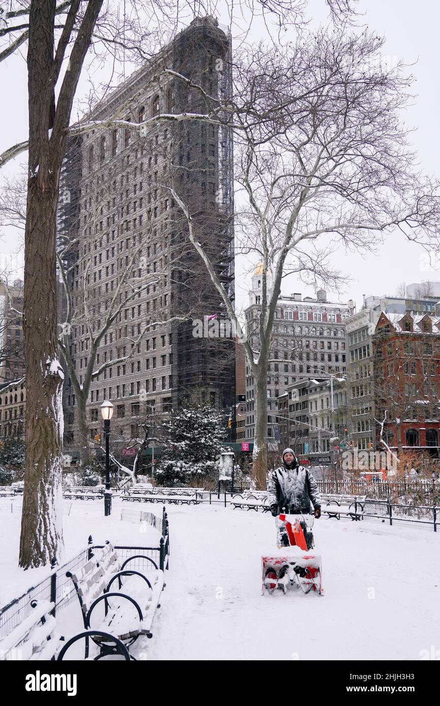 Madison Square Park after a winter storm: park employee removing snow ...