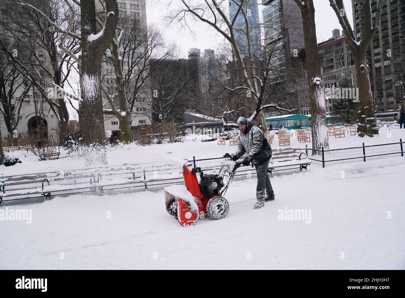 Madison Square Park after a winter storm: park employee removing snow ...