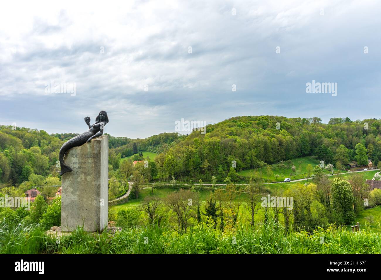Historic mermaid statue overlooking rural forests in Rothenburg ob der ...