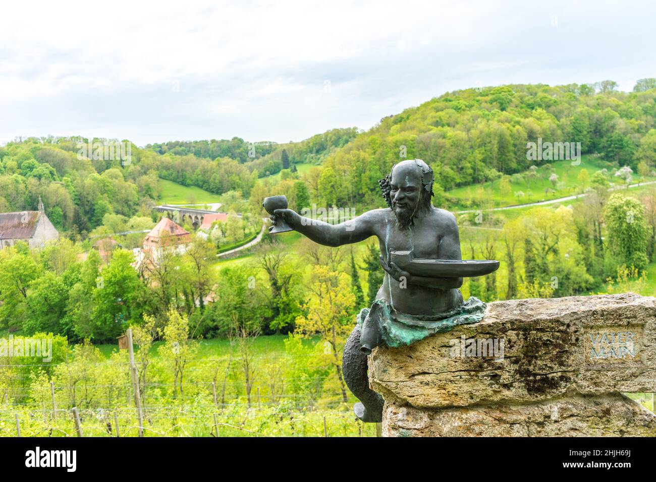Historic statue overlooking rural forests in Rothenburg ob der Tauber ...