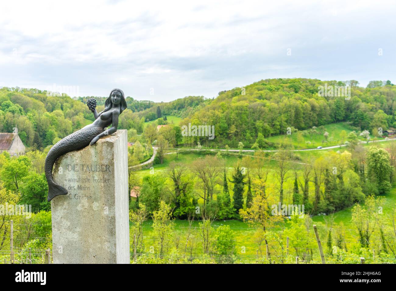 Historic mermaid statue overlooking rural forests in Rothenburg ob der ...