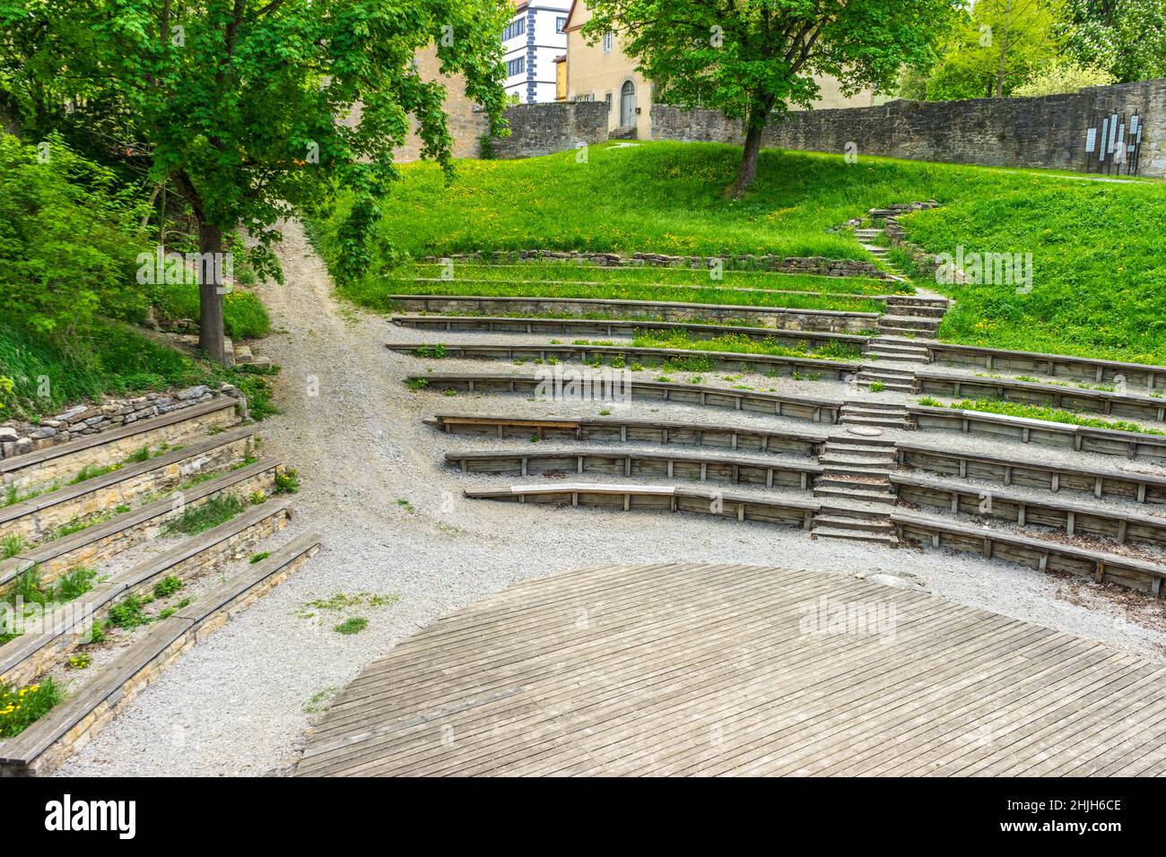 Round wooden platform and stone seats in a park in Rothenburg ob der ...