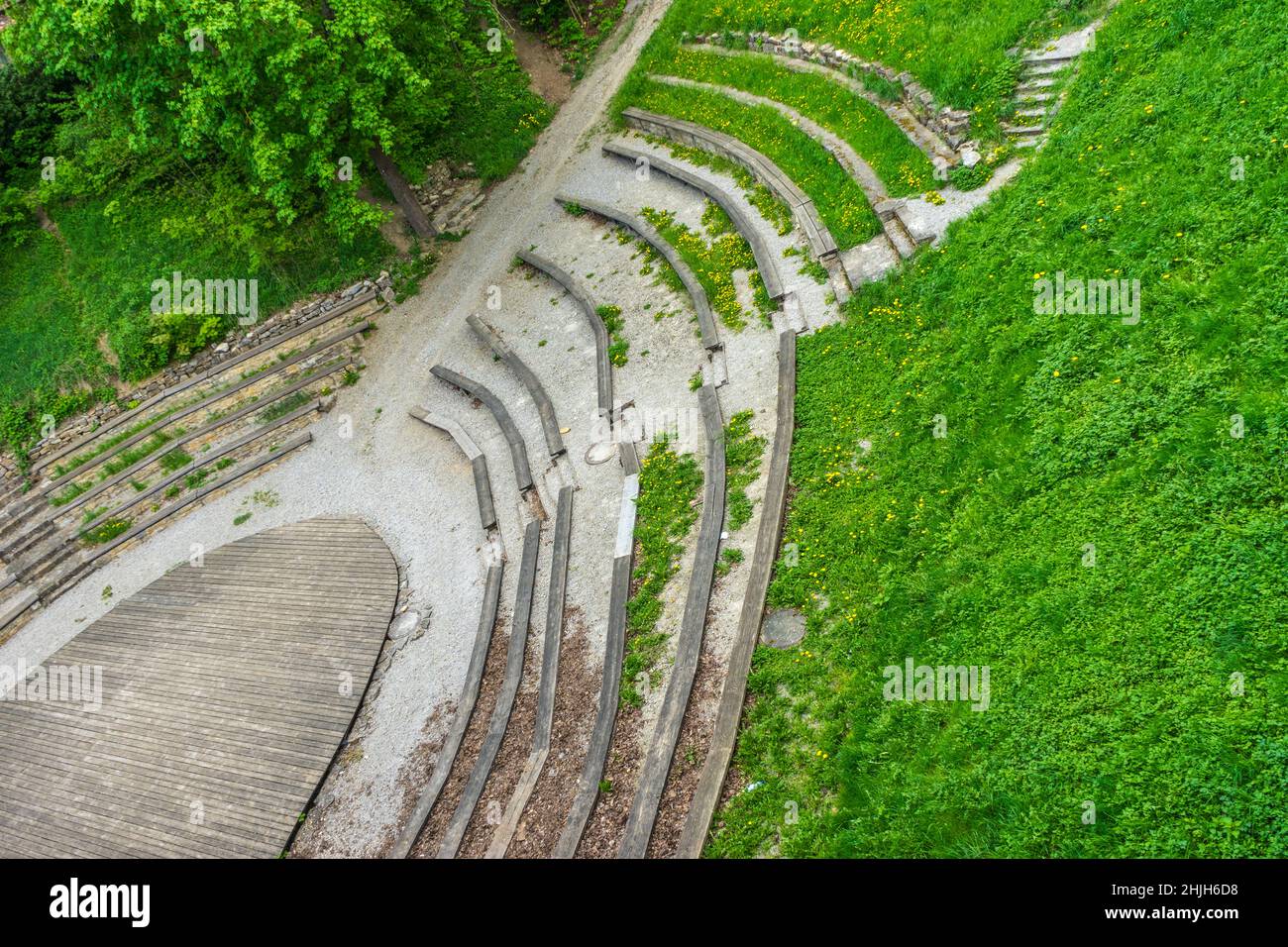Round wooden platform and stone seats in a park in Rothenburg ob der ...