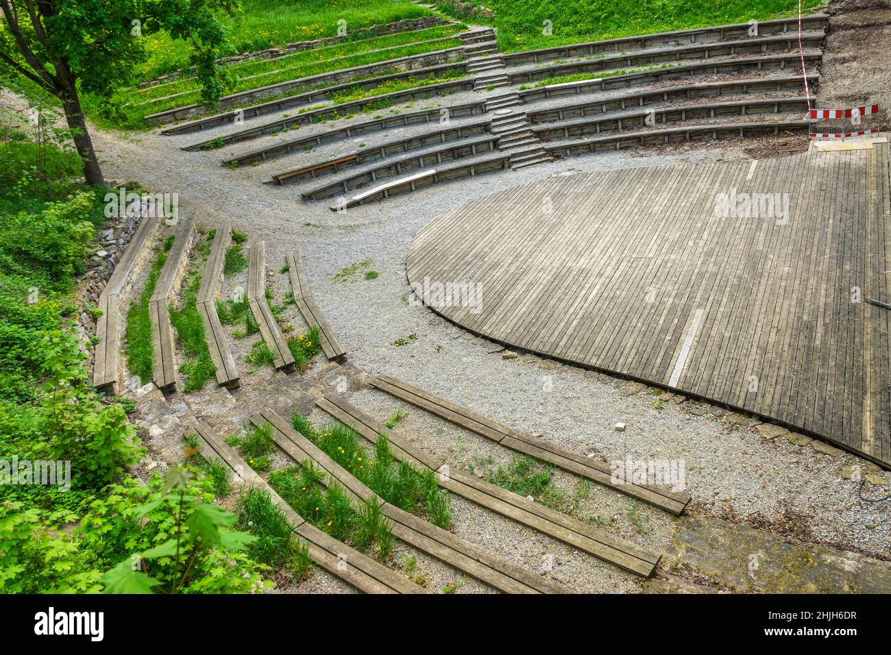 Round wooden platform and stone seats in a park in Rothenburg ob der ...