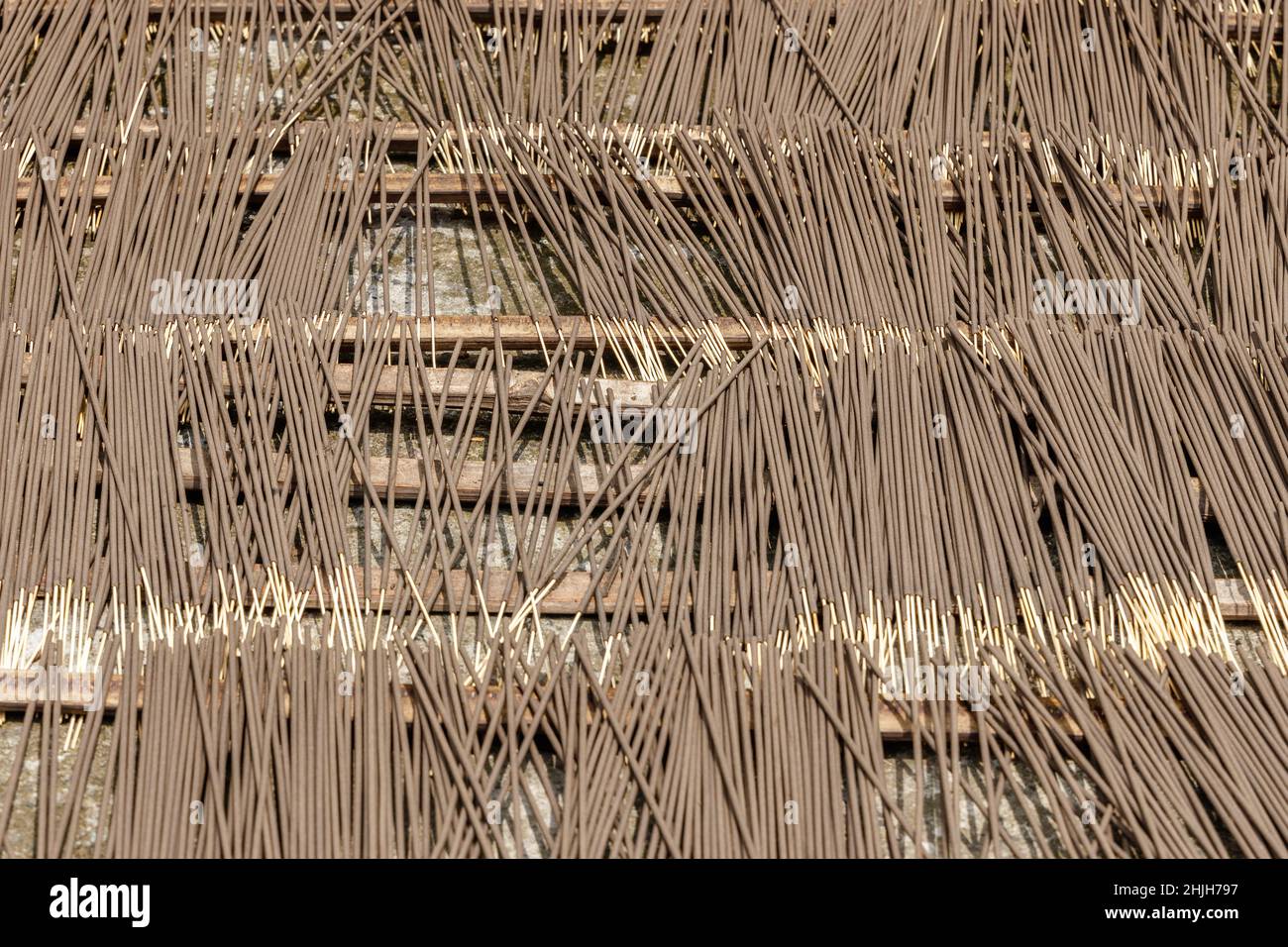 Homemade incense sticks drying on the side of the road. Gianyar, Bali ...