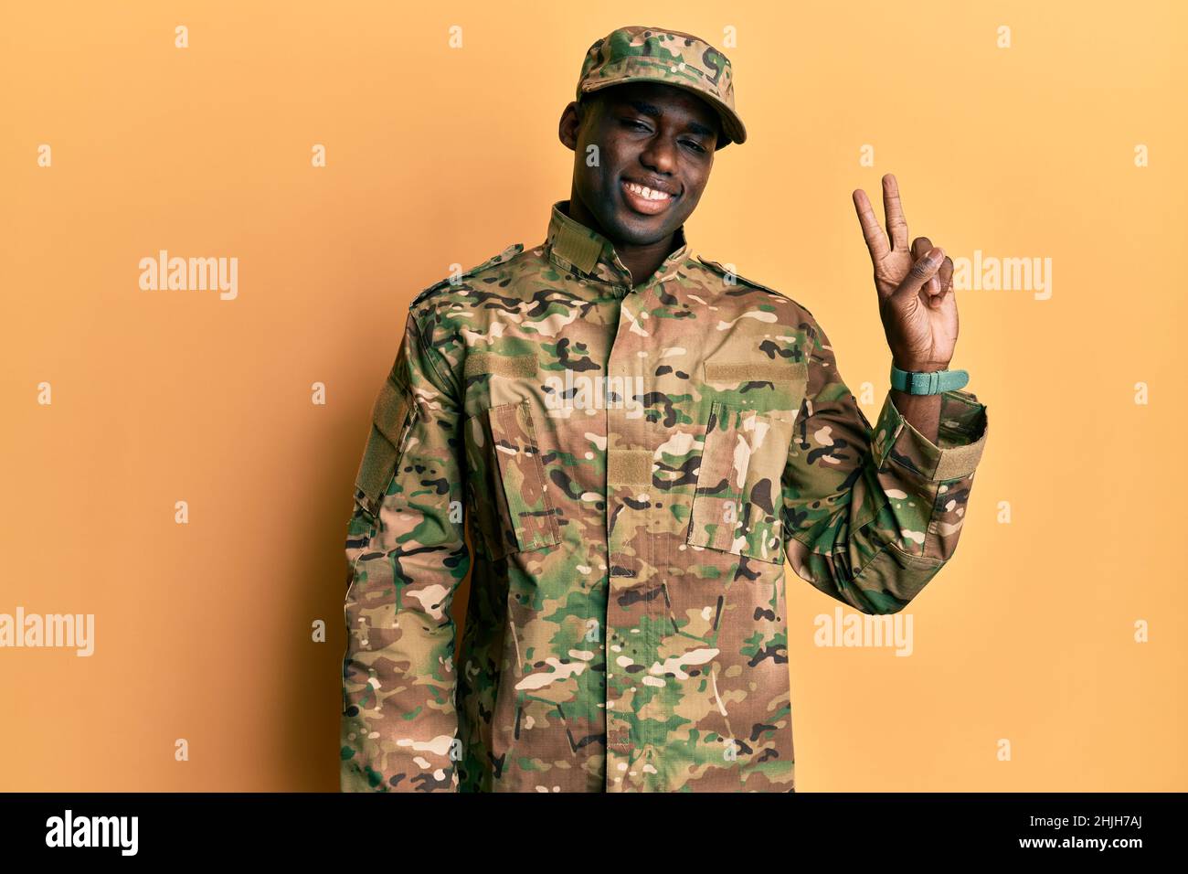 Young african american man wearing army uniform smiling with happy face ...