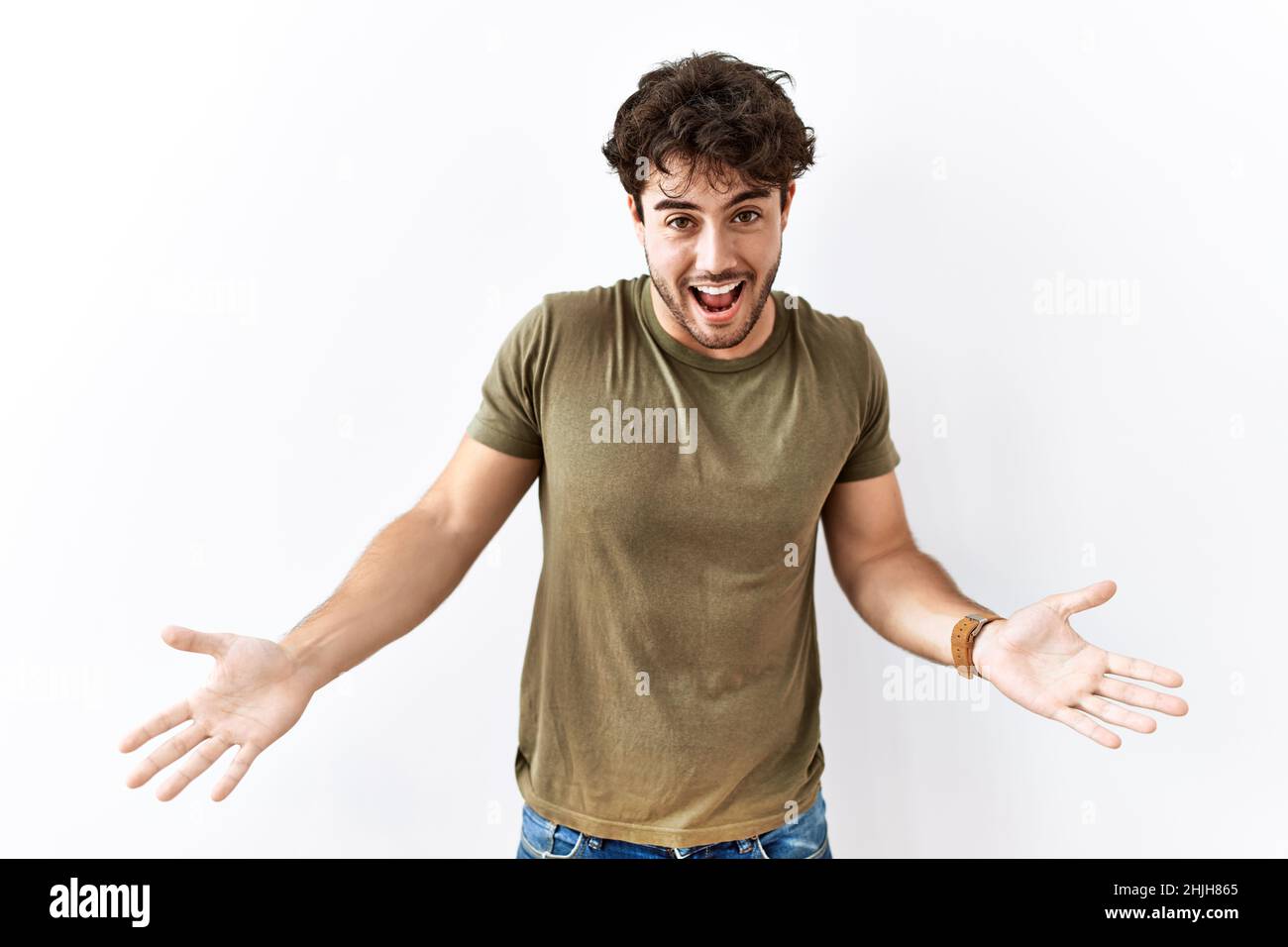 Hispanic man standing over isolated white background smiling cheerful ...