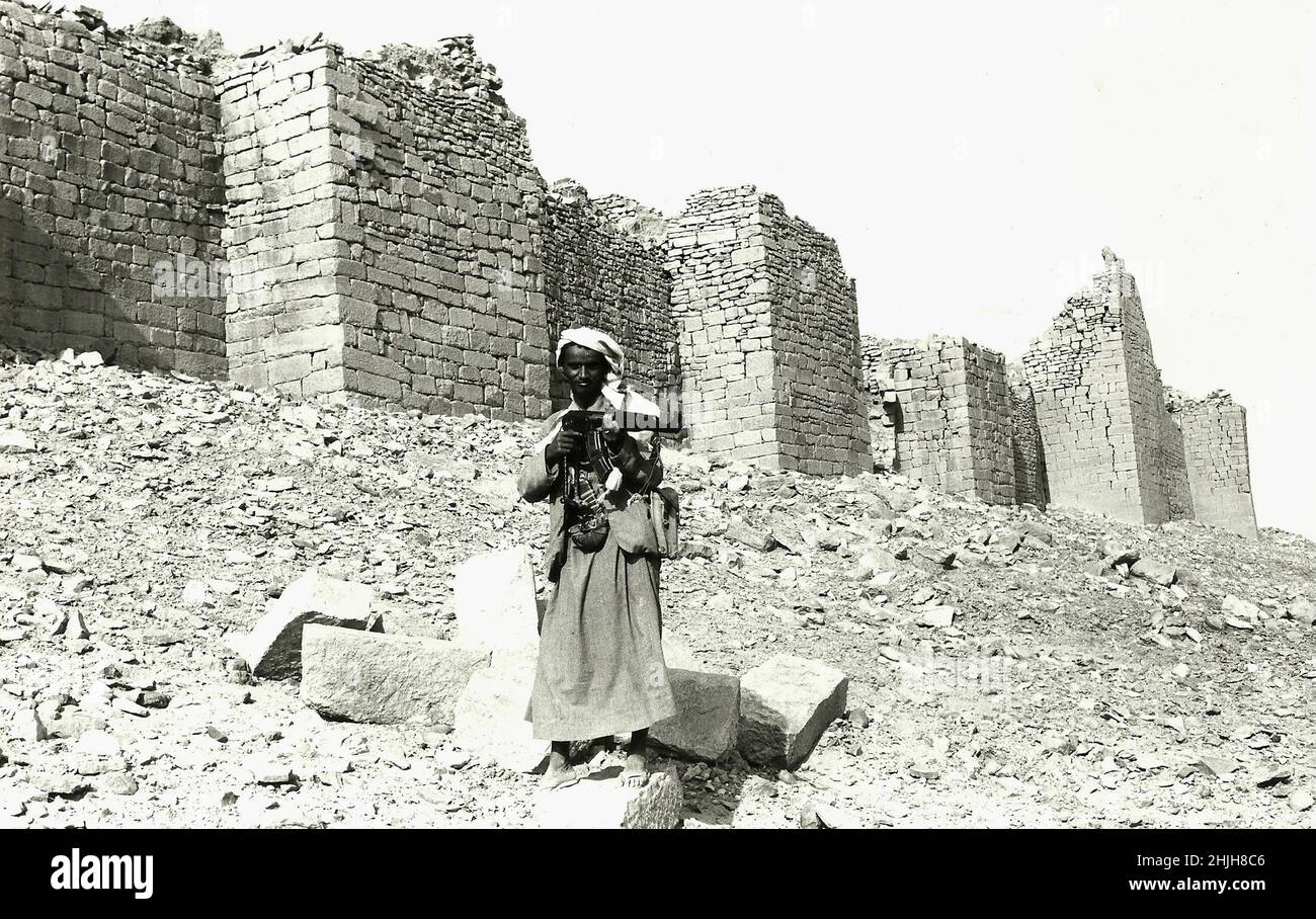 Bedouin guarding the ramparts of Baraqish, ancient Minaean city in ...