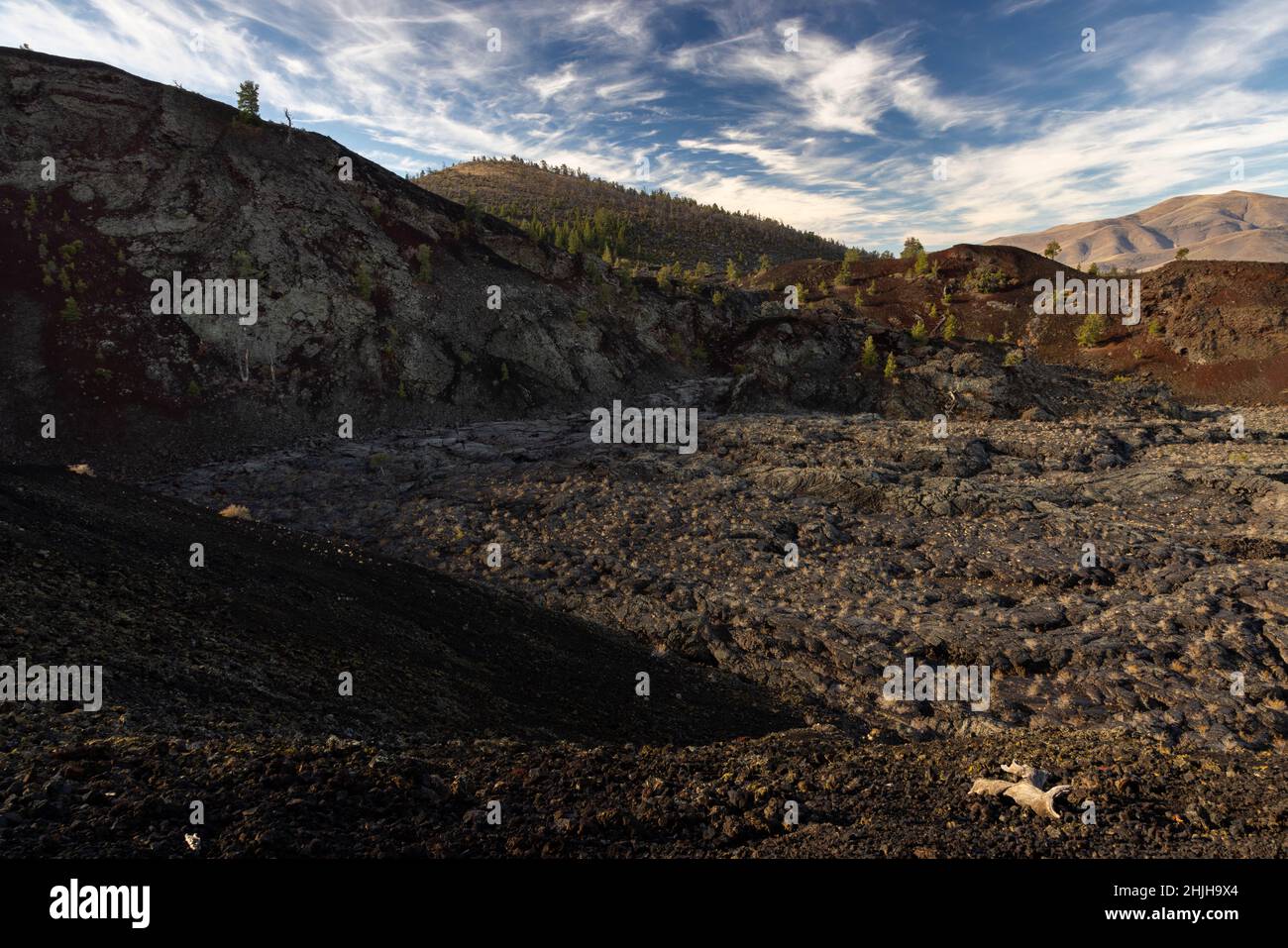 A lava flow from the North Crater stretching out below lava cliffs and ...